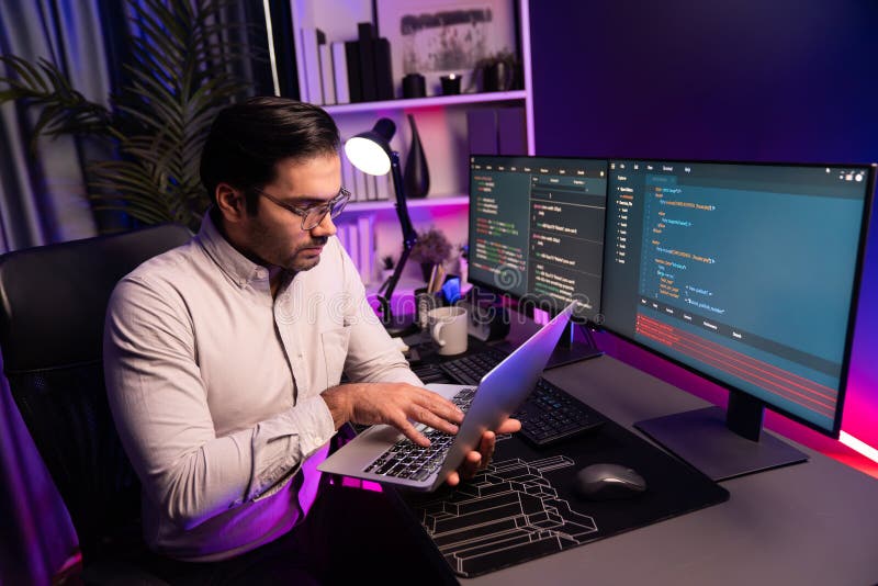 It Developer Working Laptop To Search Code System at Neon Light Office ...