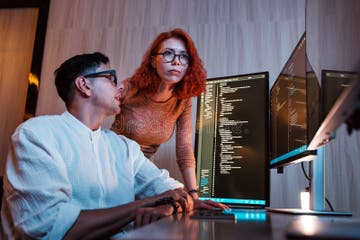 Developers Learning To Code Together on Multiple Screens. Modern ...