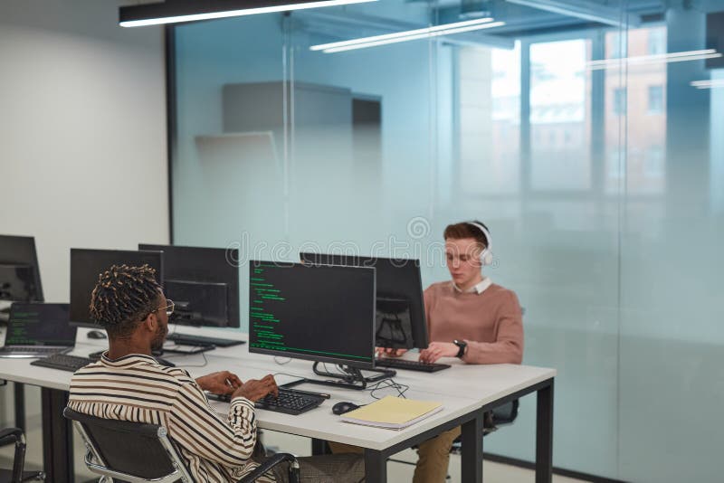 It Developers Working at Computer Desks in Office Stock Image - Image ...