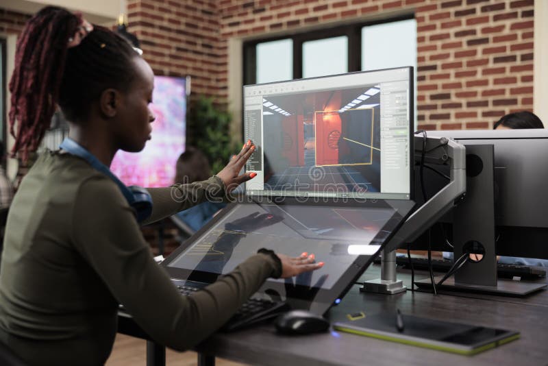 Developing Company Employee Working at Computer with Two Monitors while ...