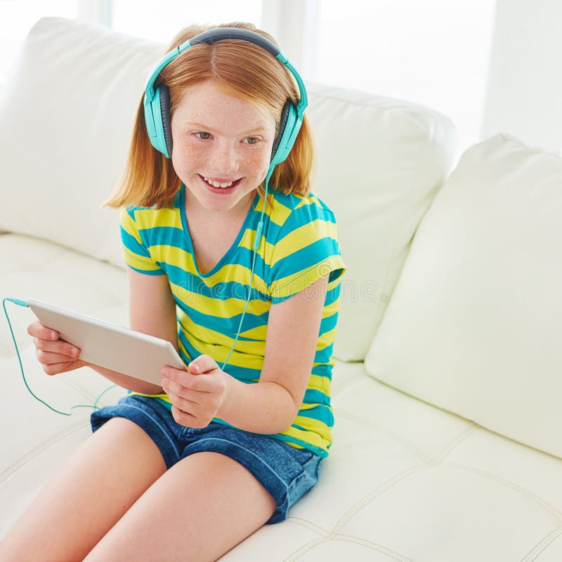 Developing Her Mind in the Digital Age. a Little Girl Using a Digital ...