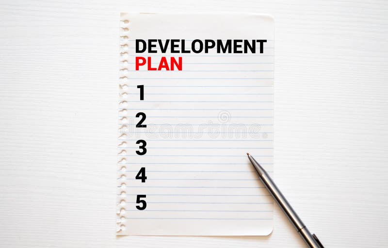 Development Plan - Office Folder on Background of Working Stock Photo ...