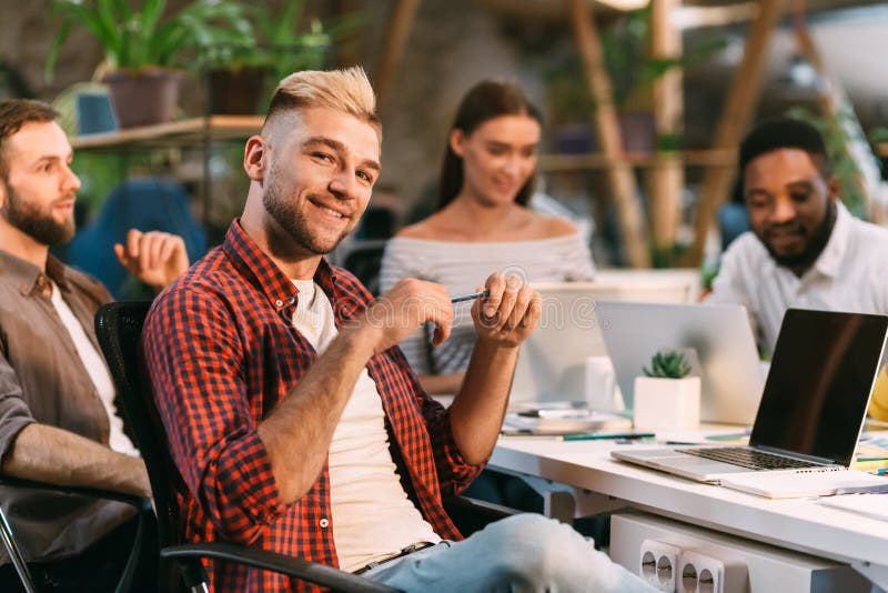 It Development. Positive Man Smiling To Camera at Workplace Stock Image ...