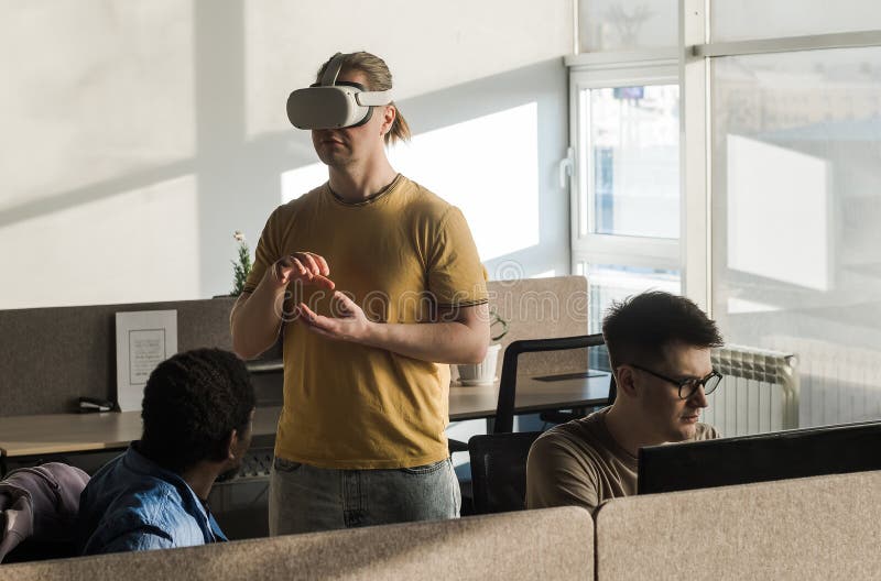 It Development Team Working on VR Project. Man Wearing VR Headset ...
