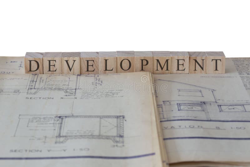Development Written on Wooden Blocks on House Extension Building Plans ...