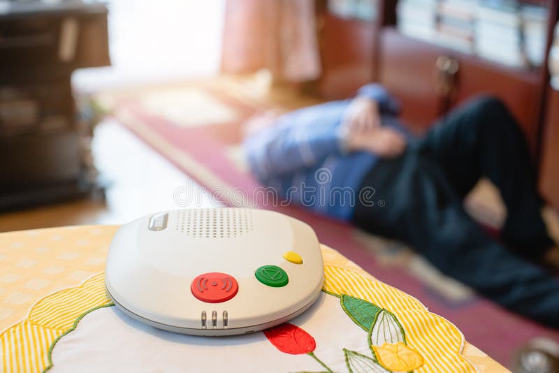 Device Delivering Emergency Single Button Call for Senior Man Stock ...
