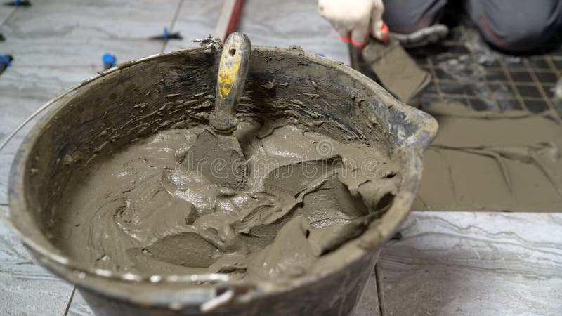 A Device for Mixing Ceramic Tile Adhesive. Glue Bucket. Mixing Glue in ...