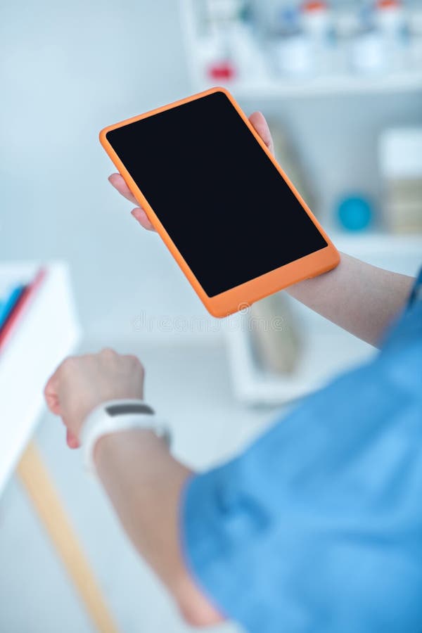 Close Up of a Human Hand with a Smartwatch and a Tablet Stock Photo ...