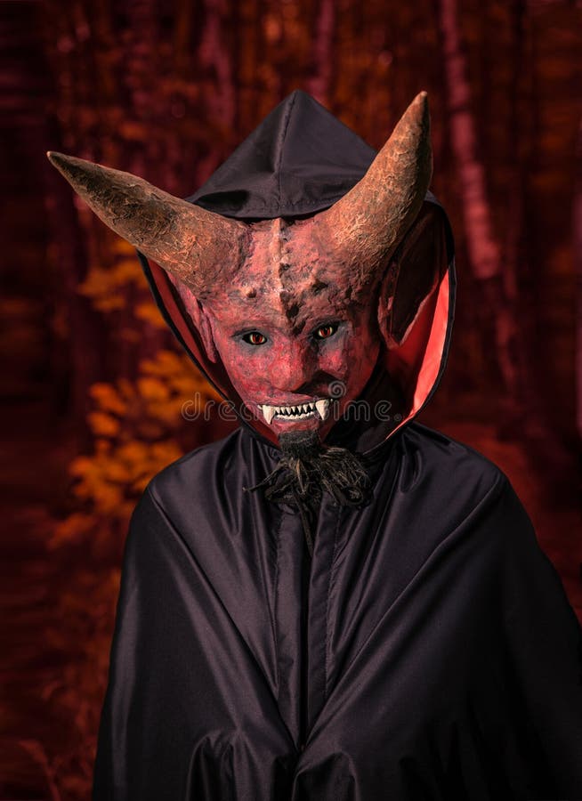 Devil in a Cloak on a Black Background Stock Image - Image of evil ...