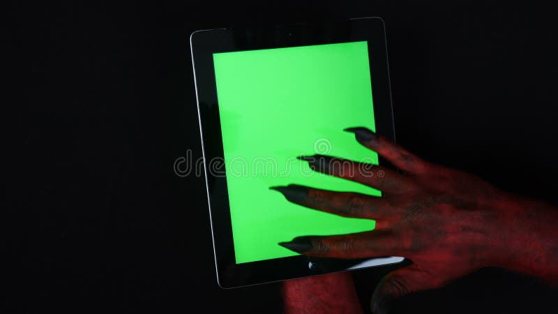 Devil`s Hand Uses Tablet PC with a Green Screen. Stock Video - Video of ...