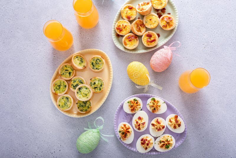 Deviled Eggs and Mini Quiches, Appetizers for Easter Stock Photo ...