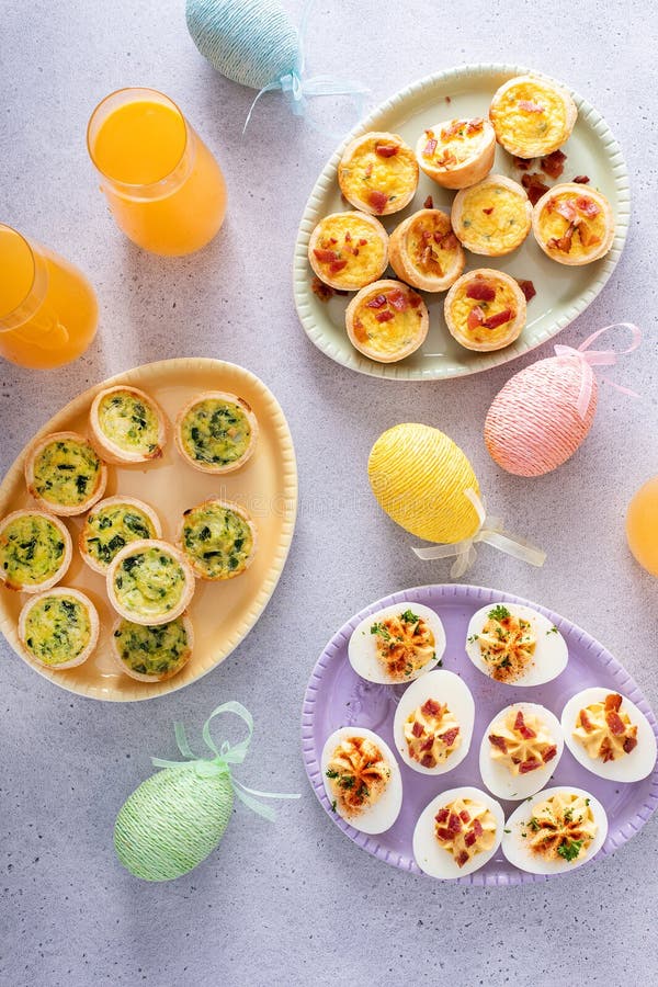 Deviled Eggs and Mini Quiches, Appetizers for Easter Stock Photo ...
