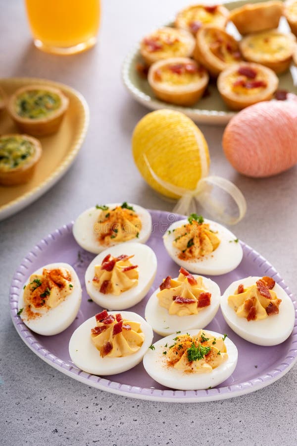 Deviled Eggs and Mini Quiches, Appetizers for Easter Stock Image ...