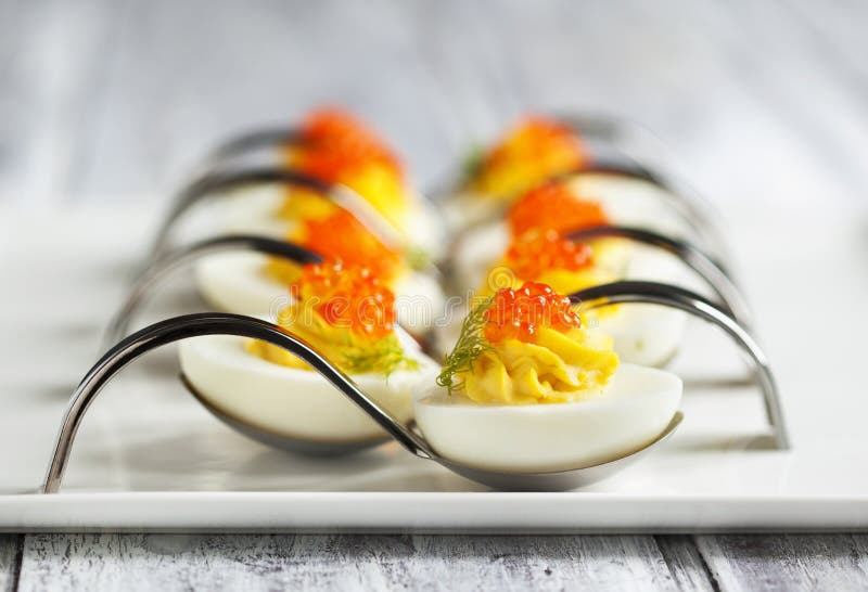 Deviled Eggs with Red Caviar in a Spoon Stock Photo - Image of holiday ...