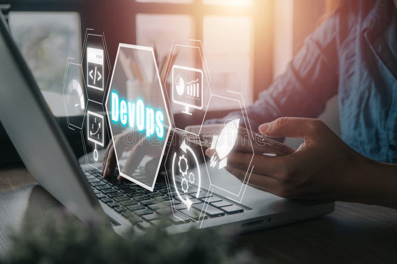 Person Working on Laptop Computer on Desk with DevOps Icon on Virtual ...