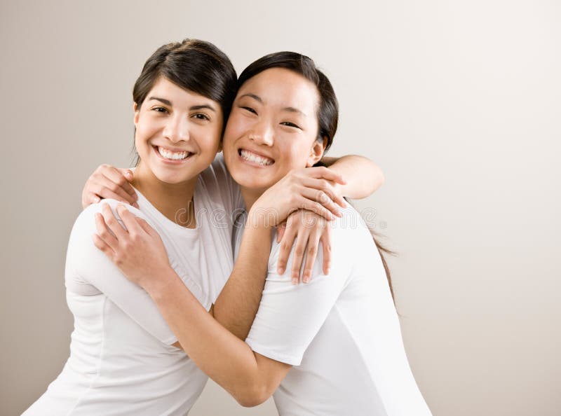 Devoted friends hugging stock image. Image of looking - 6581711