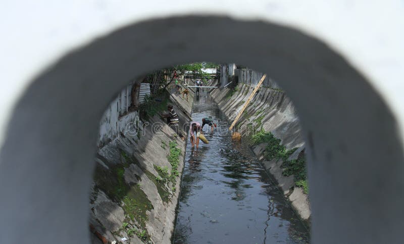 Devotedly Residents Clean Up the River in the City of Solo in Central ...