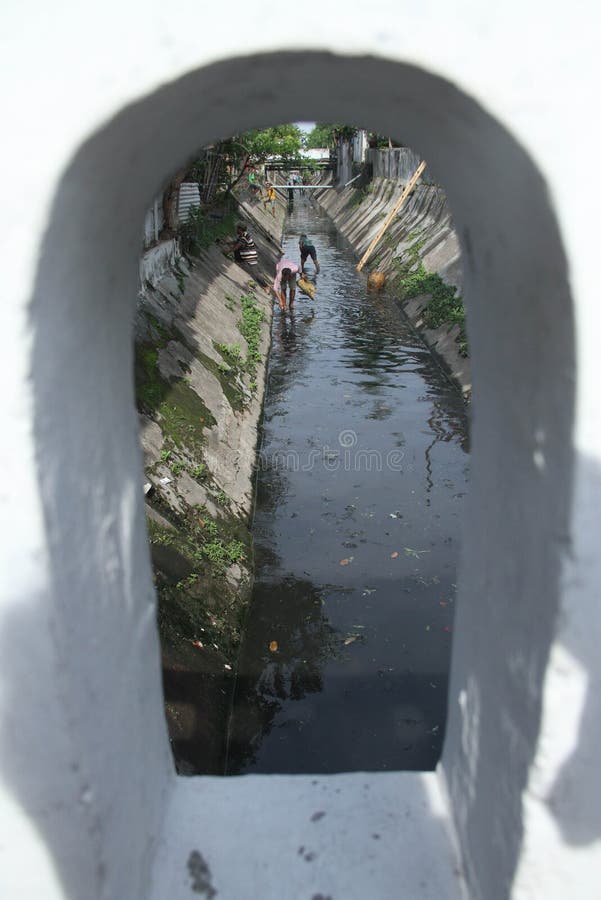 Devotedly Residents Clean Up the River in the City of Solo in Central ...