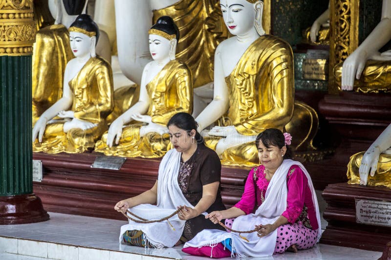 Devotees Meditating in Front of Buddha Statues, Myanmar Editorial Stock ...