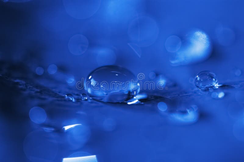 Dew drop on leaf in blue stock image. Image of bokeh - 67199543