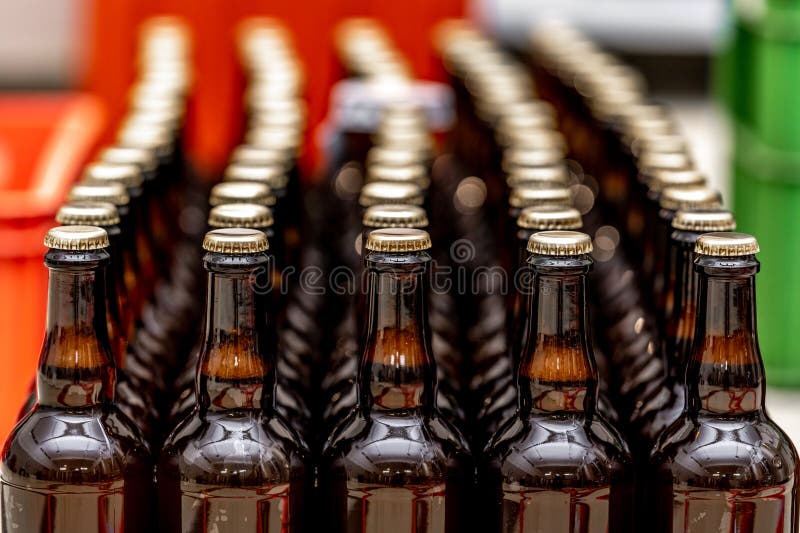 Dewy Bottles of Beer in a Row in a Warehouse Ready for Export Stock ...
