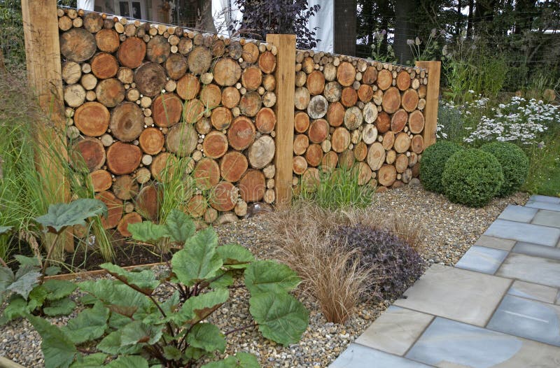 Decorative Garden Wall Made of Sliced Logs Stock Image - Image of ...
