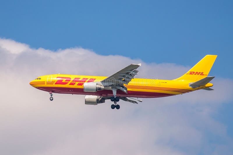 DHL Cargo Plane Flying High in the Blue Sky Editorial Photo - Image of ...