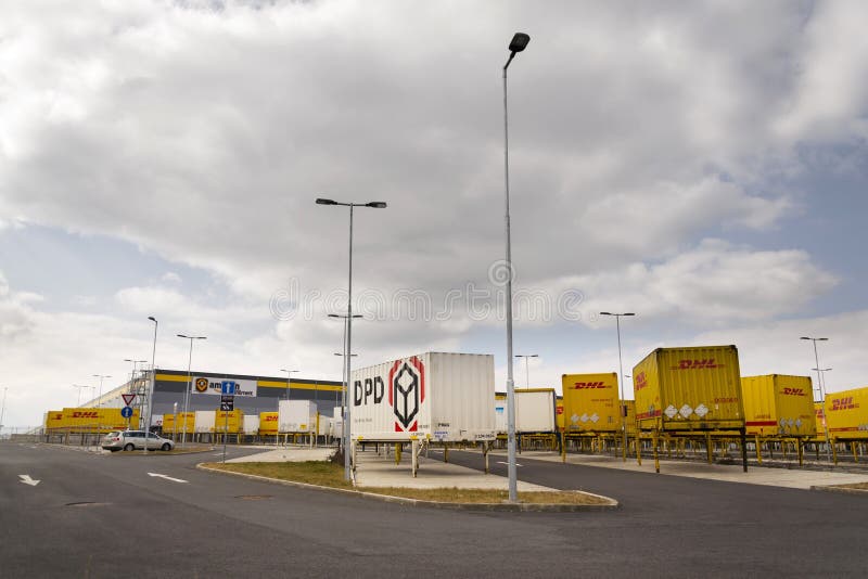 DHL and DPD Shipping Containers in Front of Amazon Logistics Building ...