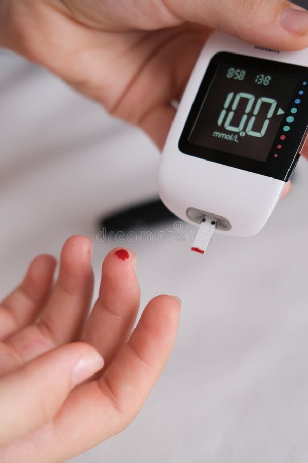 Diabetes Test. Child Hands Checking Blood Sugar Level by Glucose Meter ...