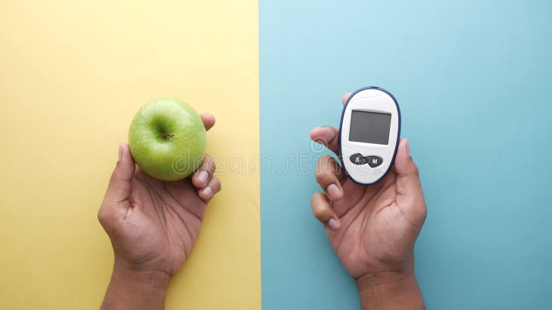 Holding Diabetic Measurement Tools and Apple on Table Stock Footage ...