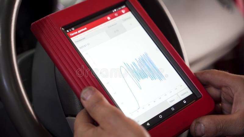 Auto Technician Uses OBD2 Scanner and Tablet To Check Vehicle Engine ...