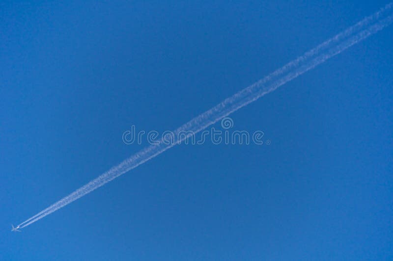 Diagonal Airplane Trace on a Clear Blue Sky Stock Image - Image of ...