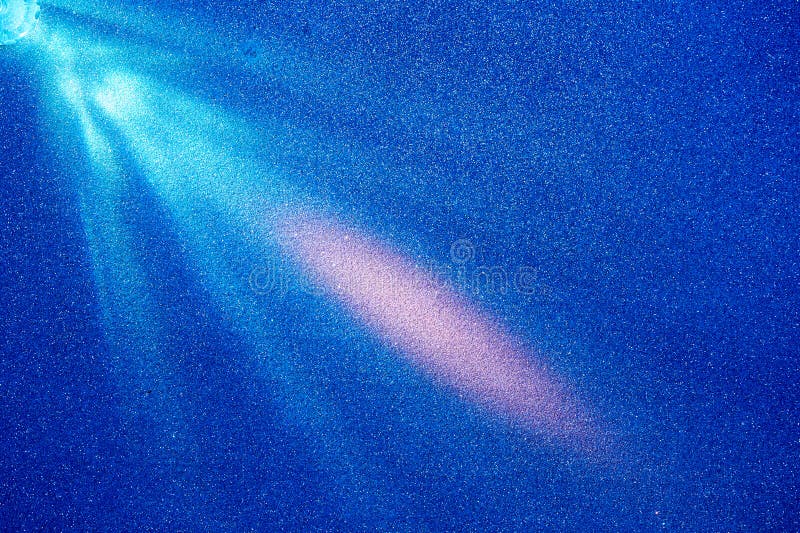 Diagonal Diffused Light Blue and Pink Beam of Light on a Blue ...