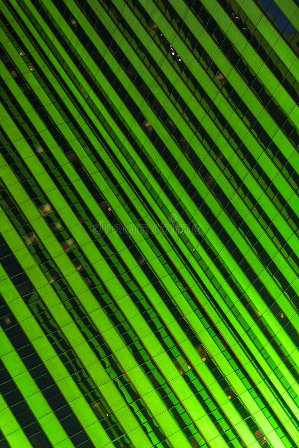 Diagonal Green Lit Building with Rows of Windows City Abstract Stock ...
