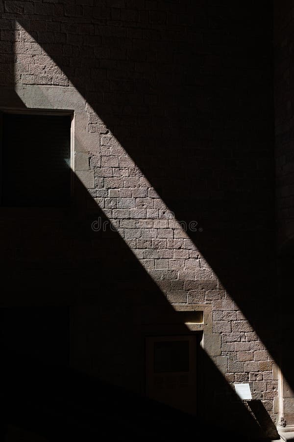 Diagonal Light Beam Passing through a Stone Wall with Windows, Contrast ...
