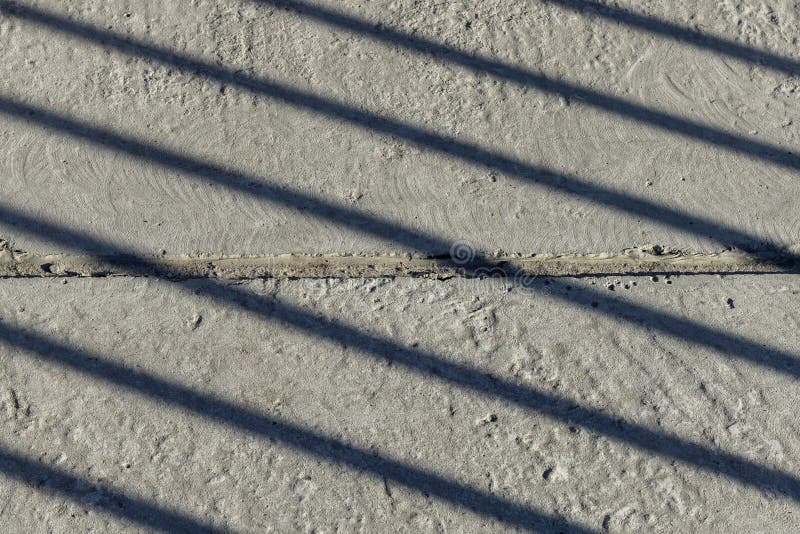 Diagonal Shadow Lines on Concrete Surface with Horizontal Line of ...