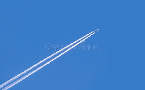 Diagonal Trace of Plane Flying in Blue Sky Stock Image - Image of ...