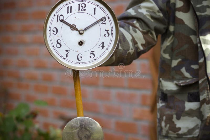 Dial with a Pendulum from an Old Watch in the Hands Stock Photo - Image ...