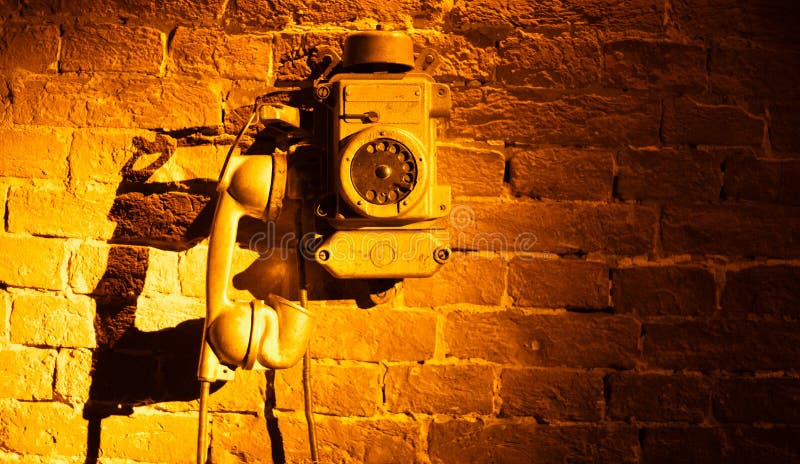 Nostalgic Echo: Old Telephone on a Rustic Brick Background Stock Image ...