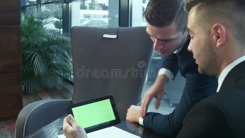 Dialogue of Businessmen Using the Touchpad with the Green Screen Stock ...