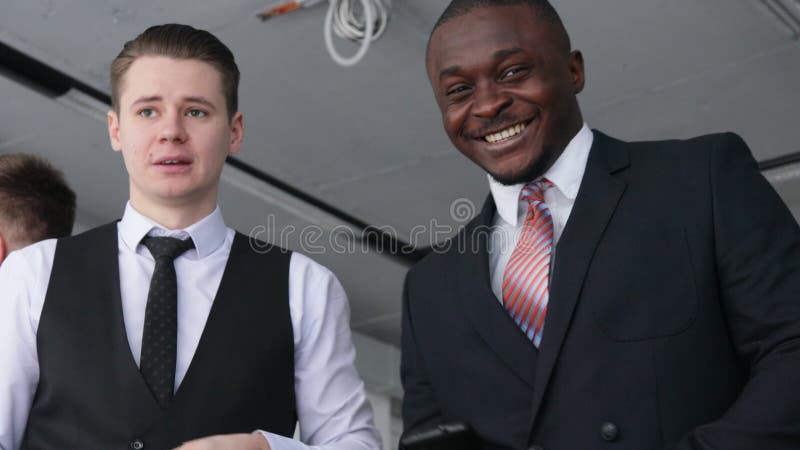 Dialogue of Two Men at Work, Young Businessmen in Suits Working and ...