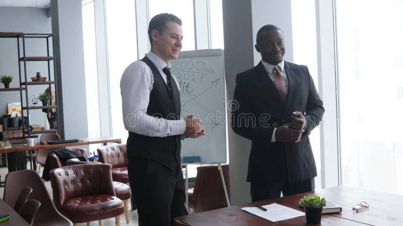 Dialogue of Two Men at Work, Young Businessmen in Suits Working and ...