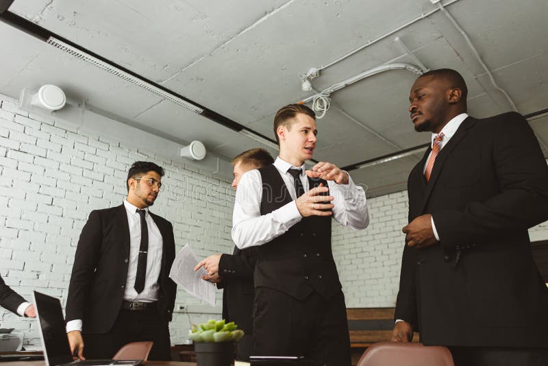 Dialogue of Two Men at Work, Young Businessmen in Suits Working and ...