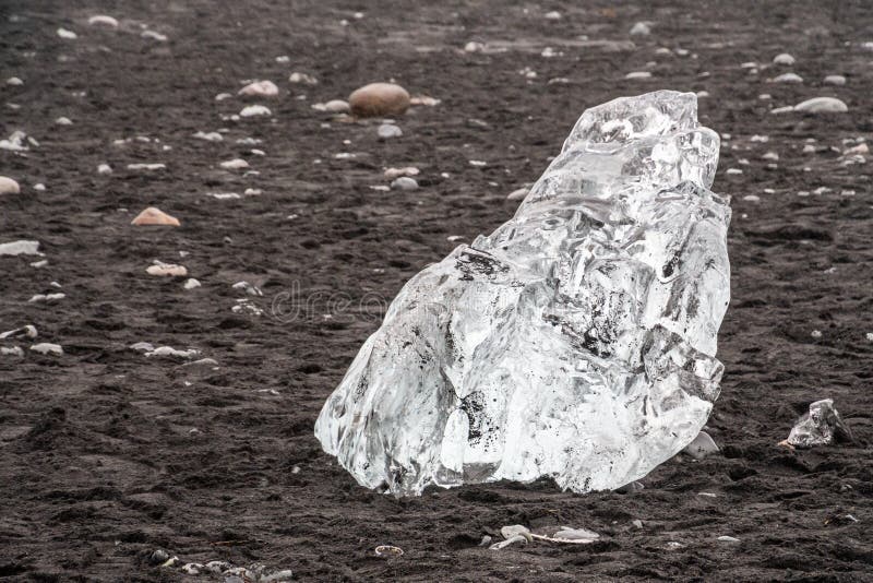 Clear Ice Piece on the Ground on Diamond Beach Stock Photo - Image of ...