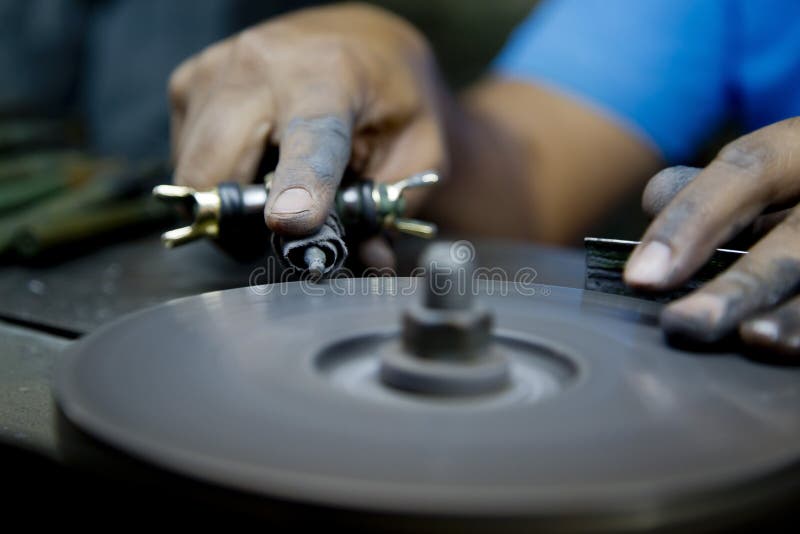 Man cutting diamond stock photo. Image of wheel, close - 16470982