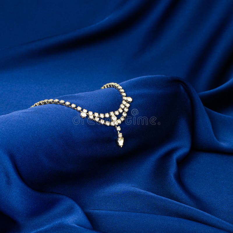 Diamond Necklace on a Blue Fabric Background Stock Photo - Image of ...