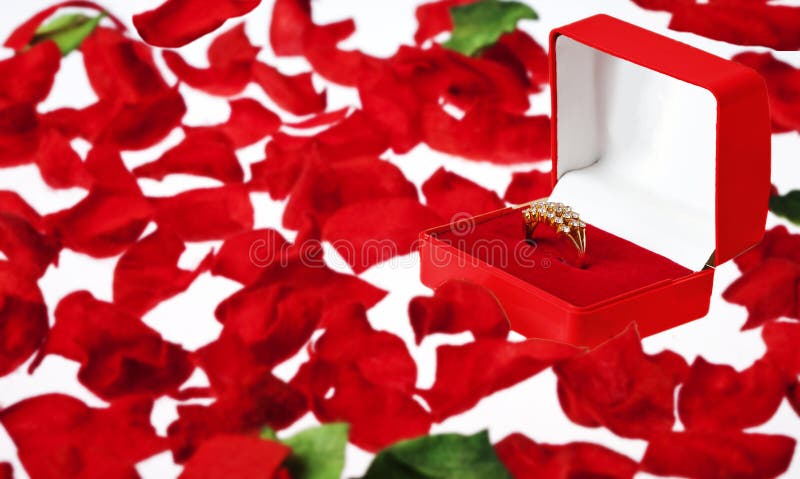 Diamond Ring in a Jewelry Case on Rose Petals Stock Photo - Image of ...
