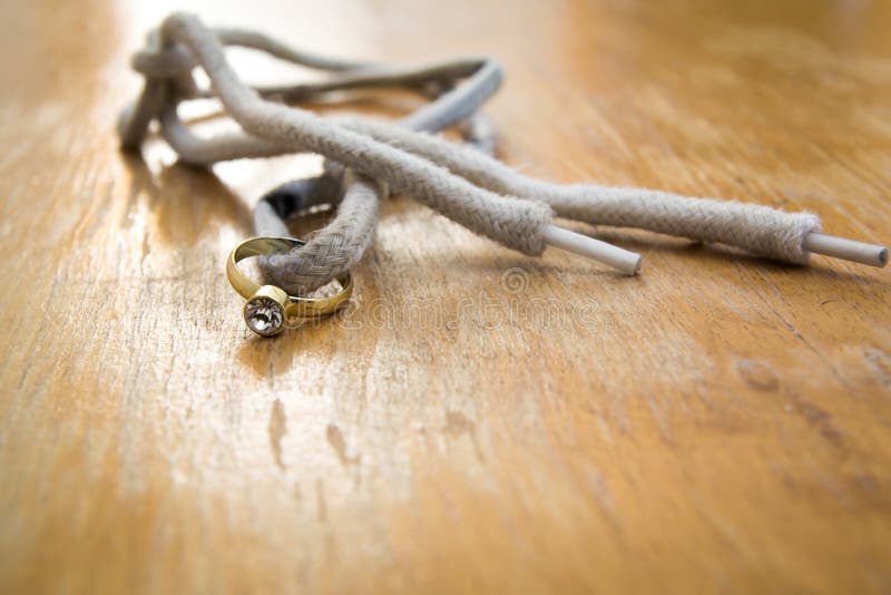 Diamond ring on a shoelace stock photo. Image of gold - 40895324