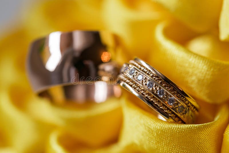Diamond Ring on Yellow Flower. Wedding Rings Together Stock Photo ...