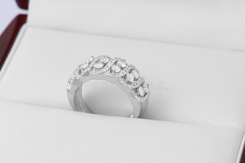 Diamonds in Silver and Gold Rings Stock Photo - Image of light, gold ...